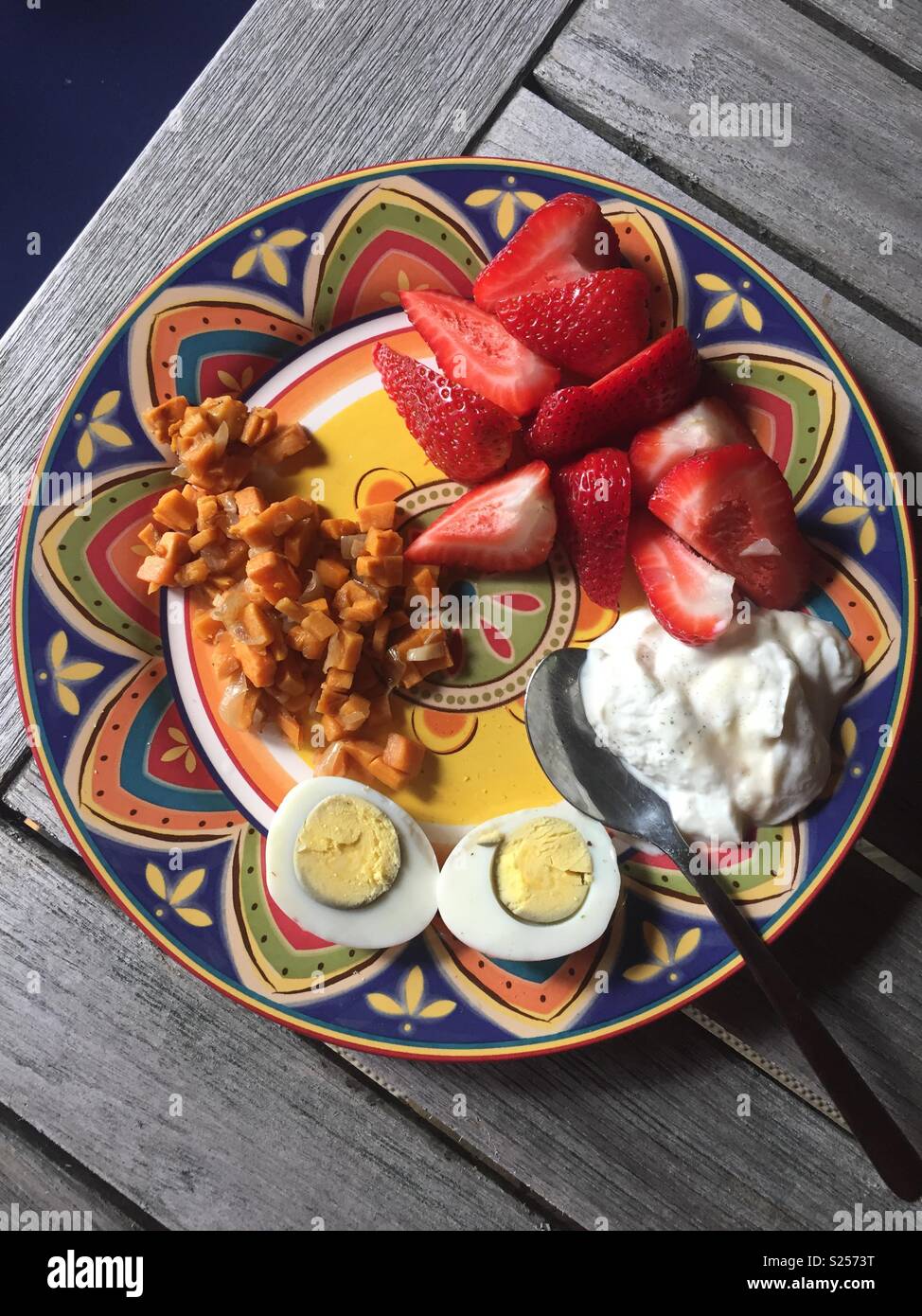 Healthy breakfast on colourful plate Stock Photo - Alamy