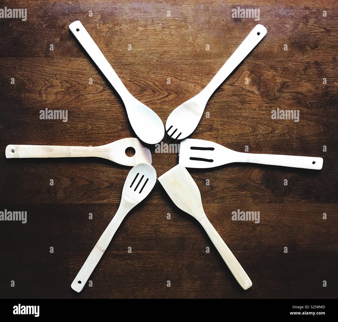 Wooden kitchen utensils on table Stock Photo - Alamy