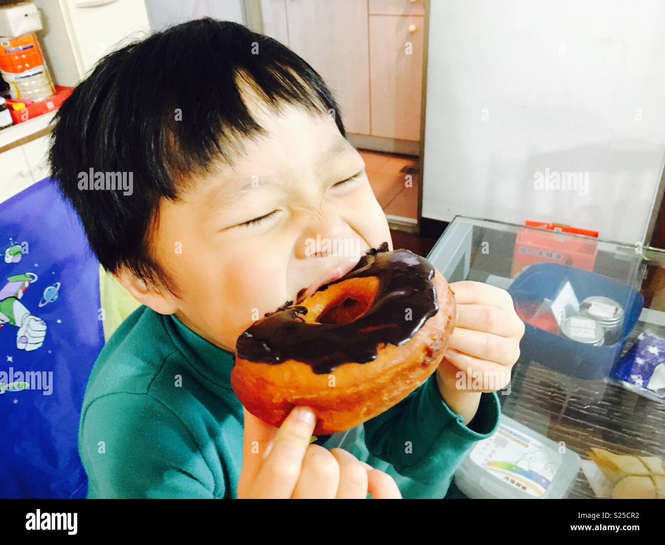 Kid Eating Donut High Resolution Stock Photography and Images - Alamy