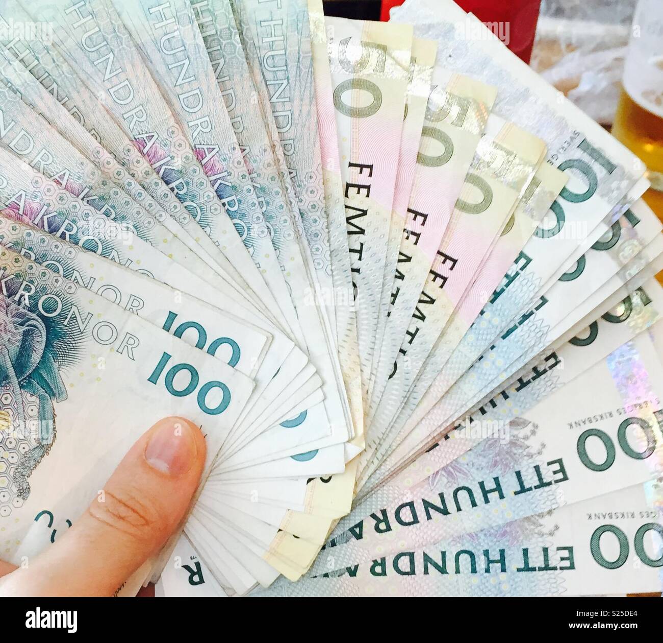 Hand full of notes Stock Photo - Alamy