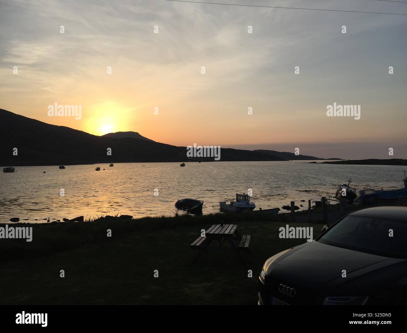 Sunrise over the Isle of Barra from Vatersay Stock Photo - Alamy