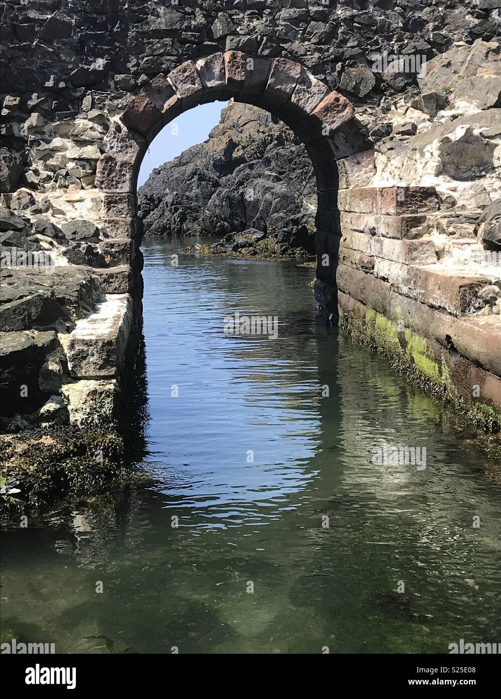Through the arched window Stock Photo - Alamy