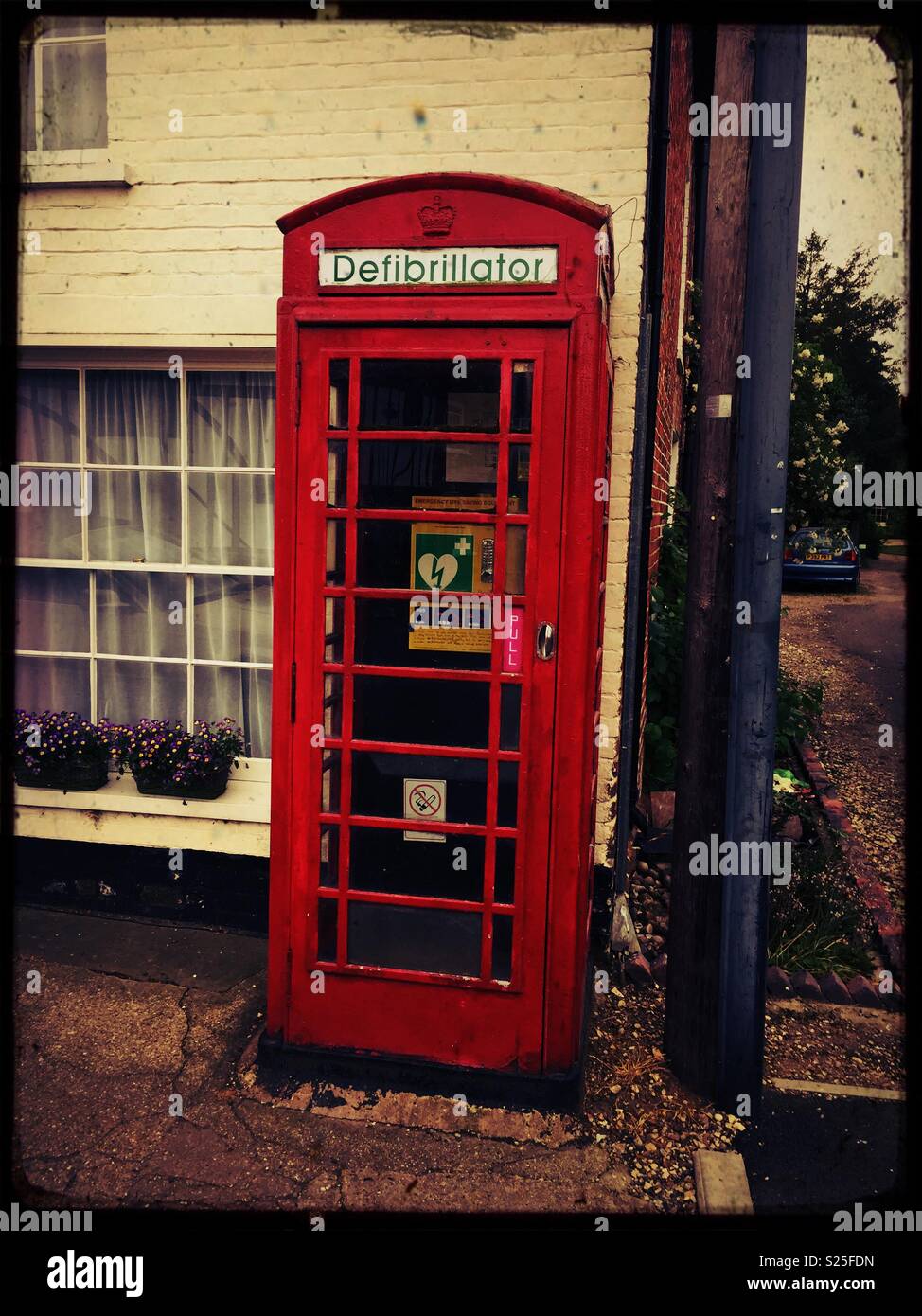 Life line in a red telephone box Stock Photo - Alamy