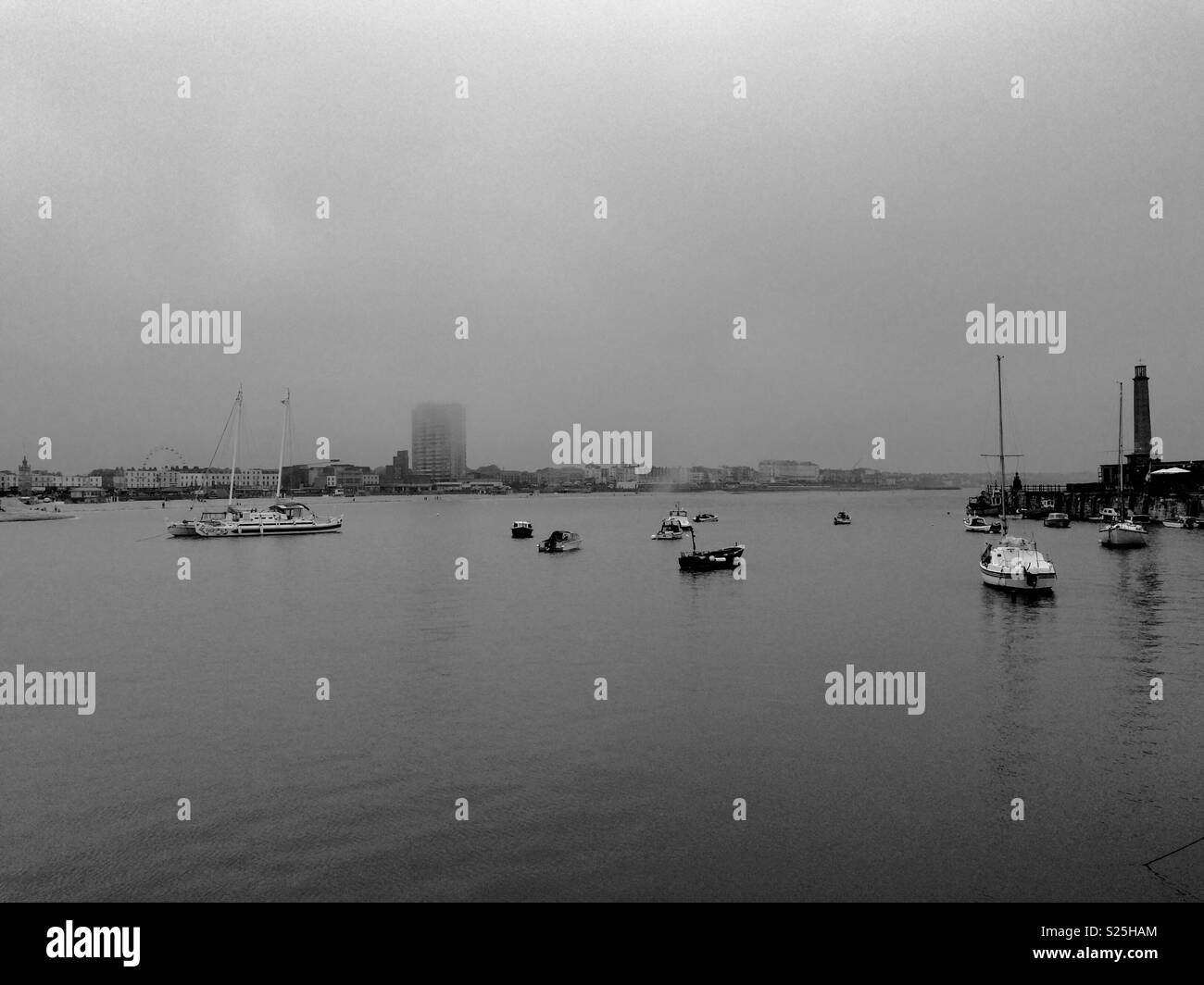 Mist over the sea at Margate, Kent. Black and white Stock Photo - Alamy