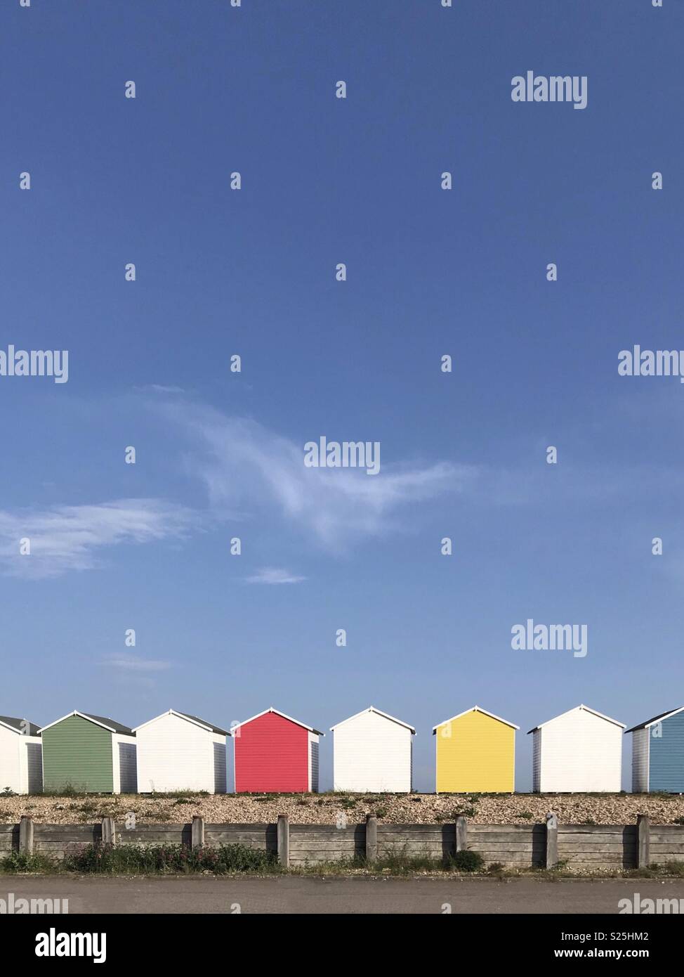 Line of Beach Huts Stock Photo - Alamy