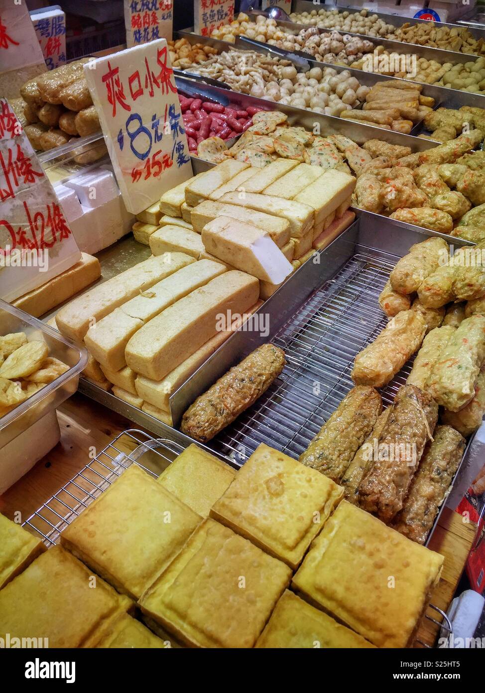 Different types of tofu for sale in a food market, Yuen Long, New ...