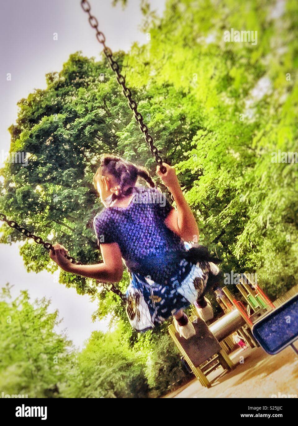 Girl on a swing Stock Photo - Alamy