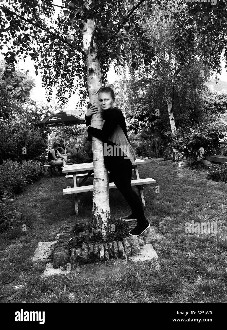 Hugging tree Black and White Stock Photos & Images - Alamy