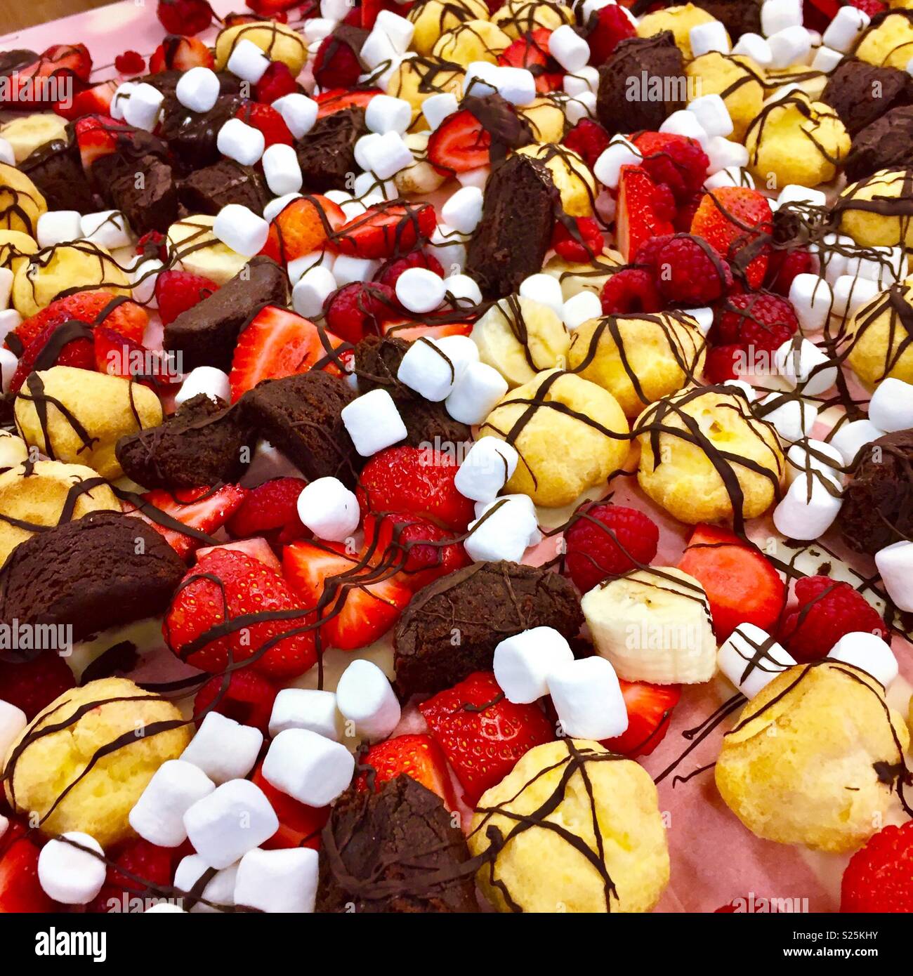 Brownies, strawberries, marshmallow - Surprise dessert table Stock ...