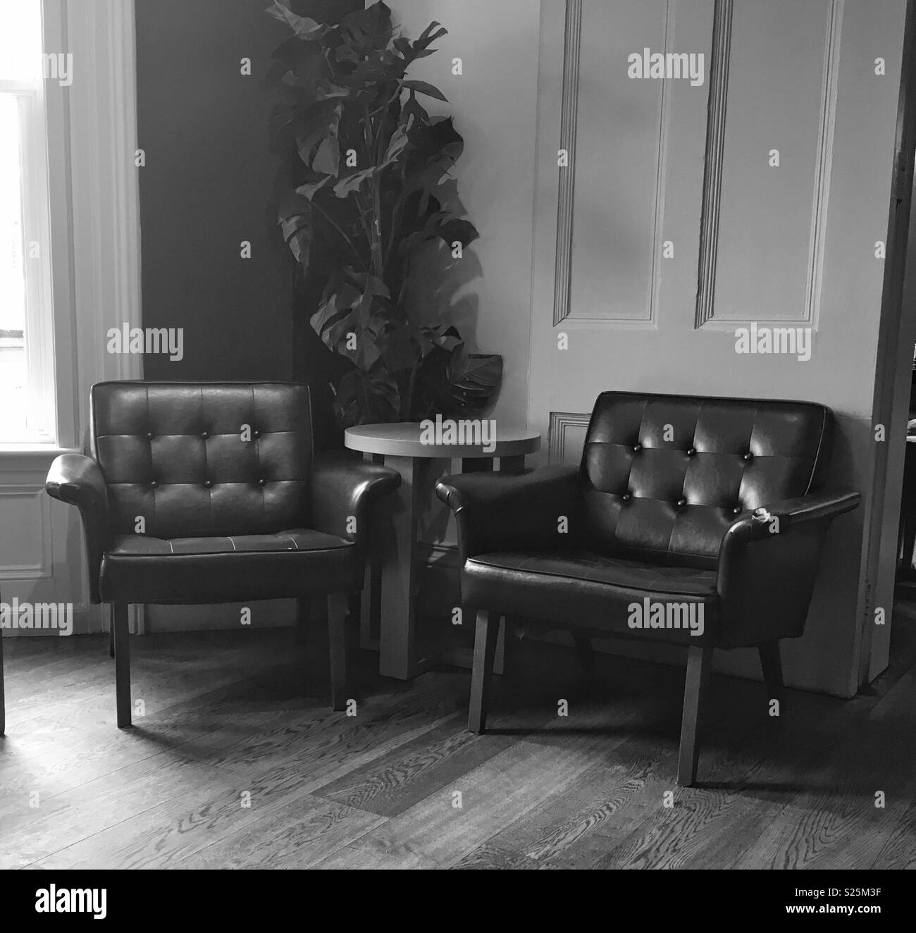 Three’s a crowd: chairs and table in bar Stock Photo - Alamy