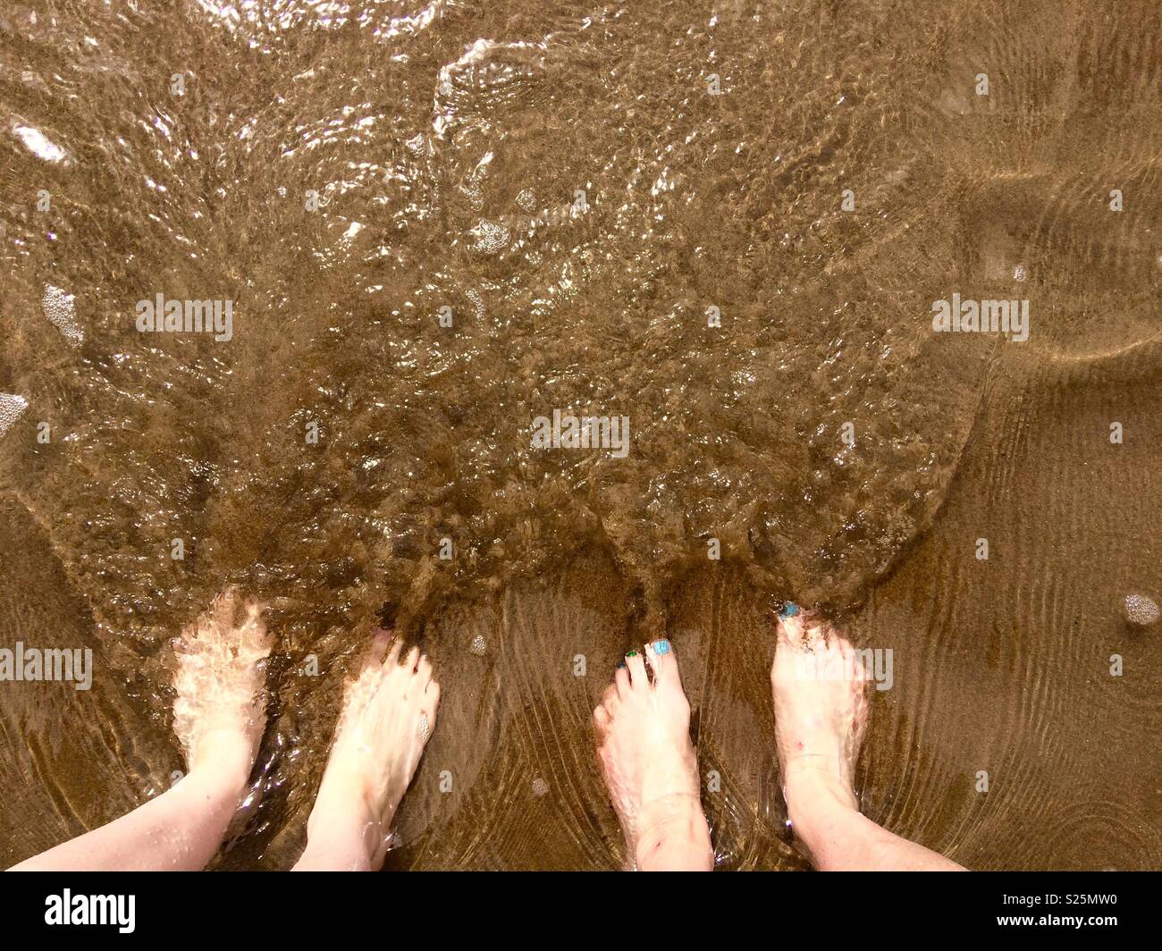 Standing under waves hi-res stock photography and images - Alamy