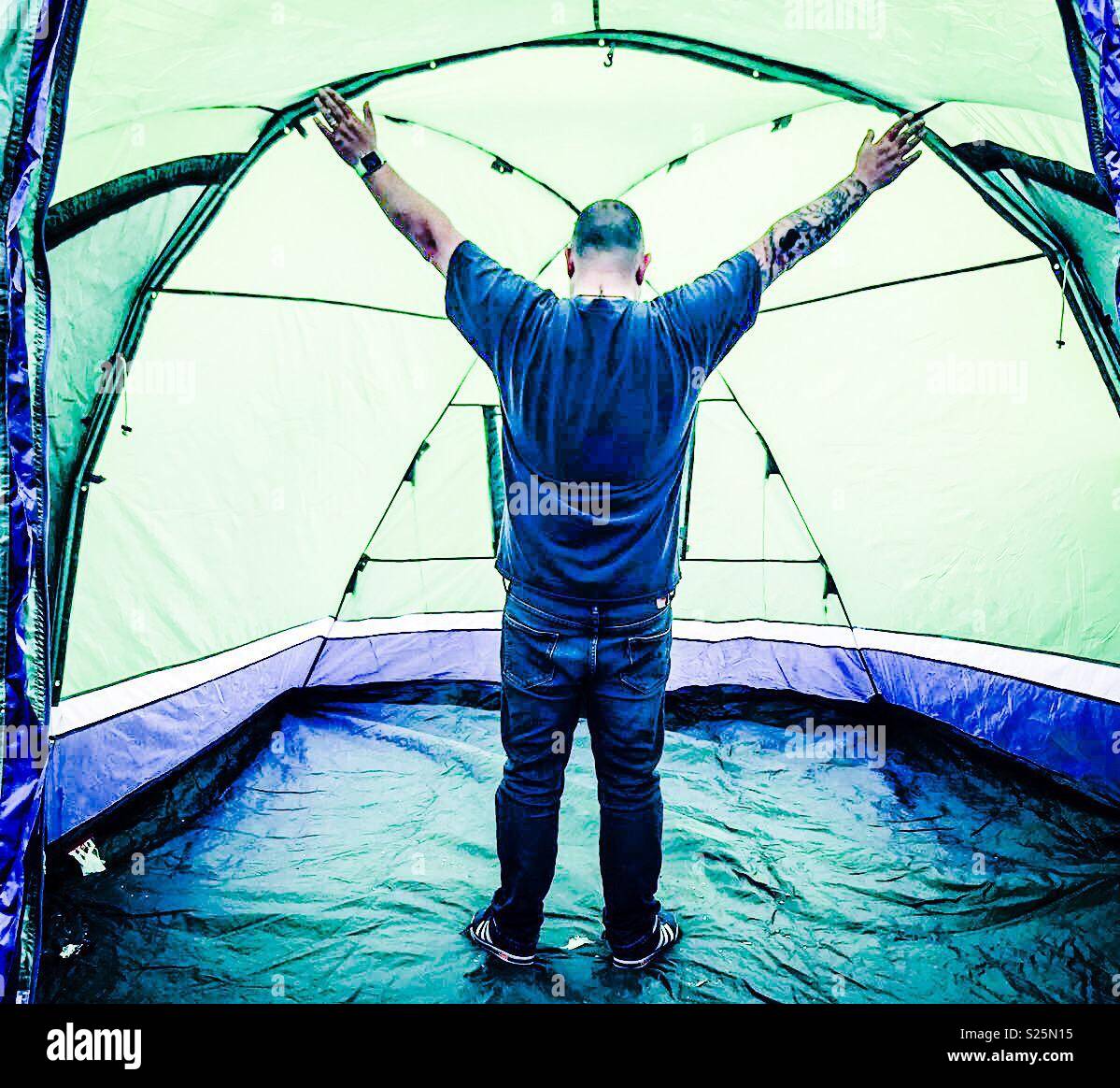 Man in tent Stock Photo - Alamy