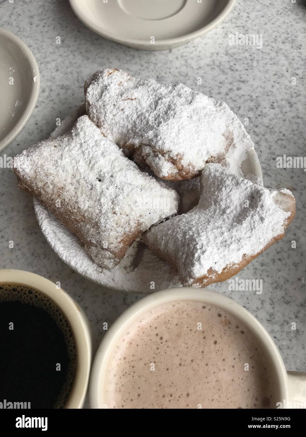 Beignets at Cafe du Monde in New Orleans Stock Photo - Alamy