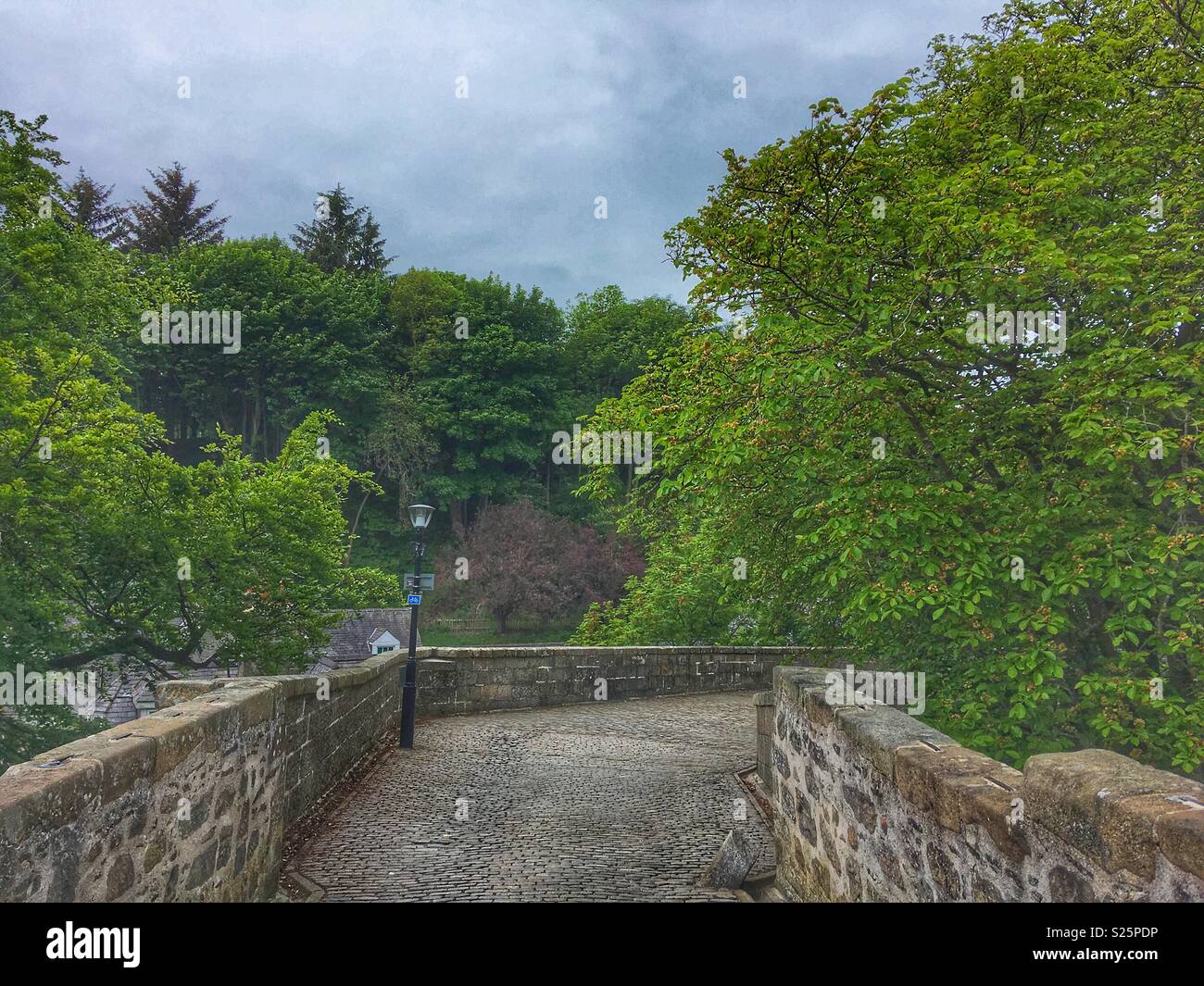 Old town bridge with cobblestones Stock Photo - Alamy