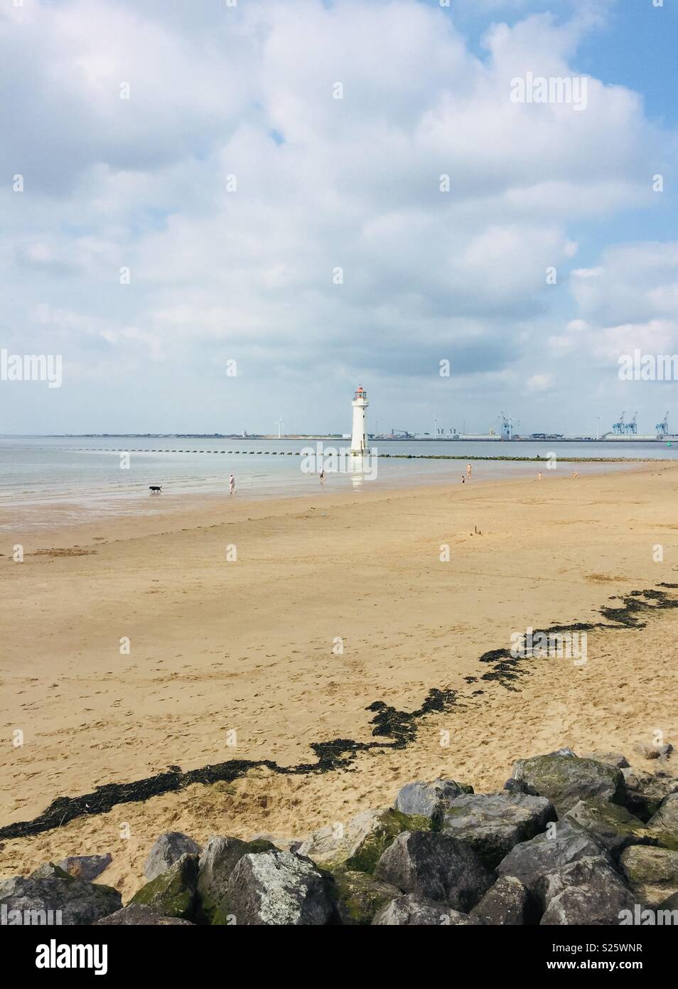 The beach and lighthouse at New Brighton Stock Photo - Alamy