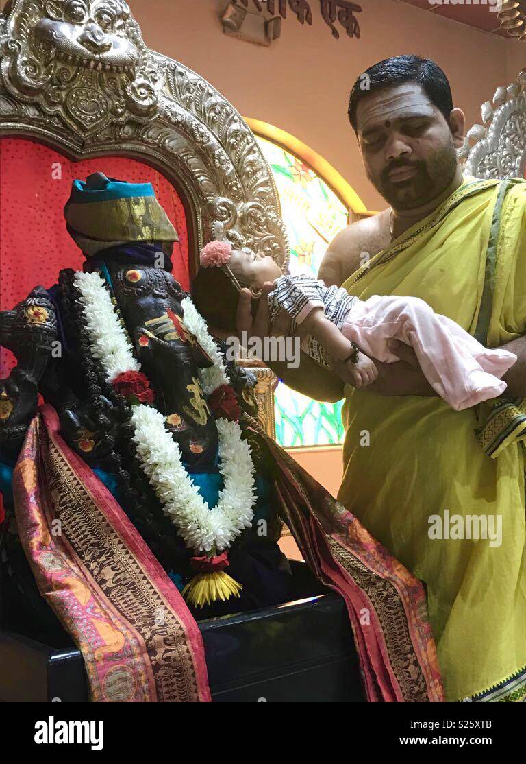 Baby blessing hindu hi-res stock photography and images - Alamy