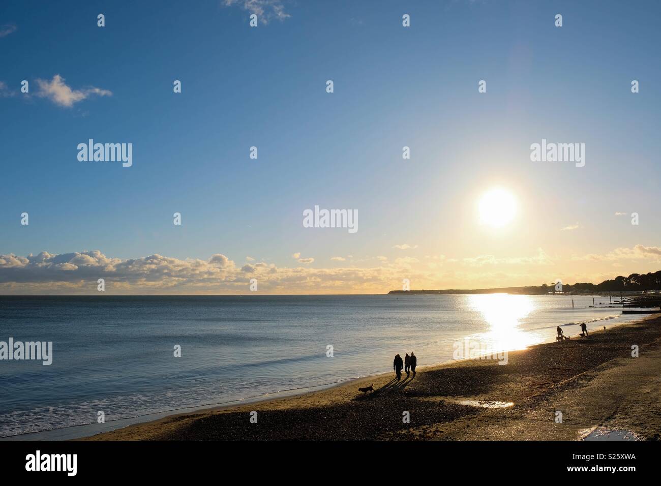 Walking on the beach - Sunset Stock Photo - Alamy