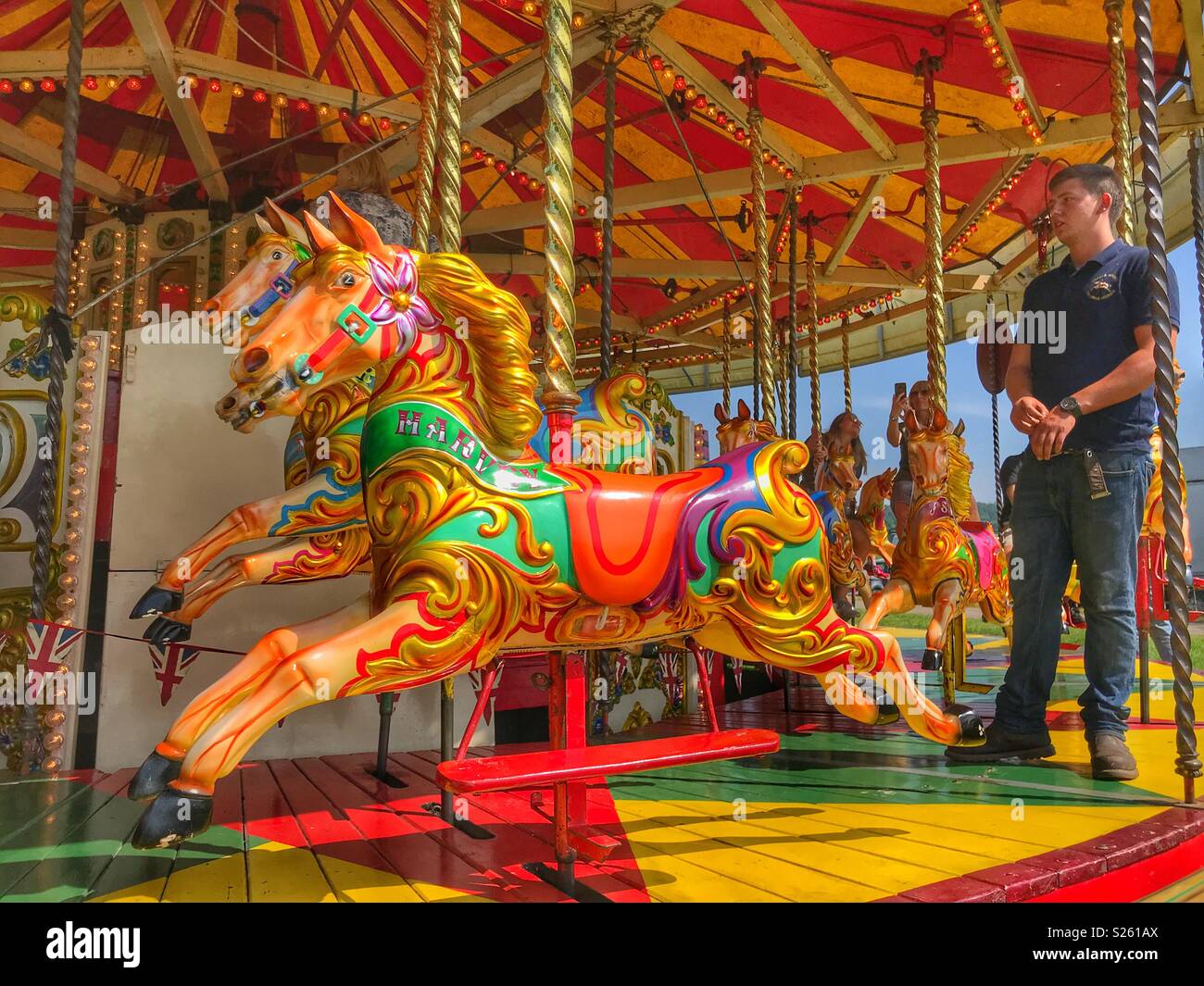 Merry-go-round, a traditional carousel with horses, at the annual ...