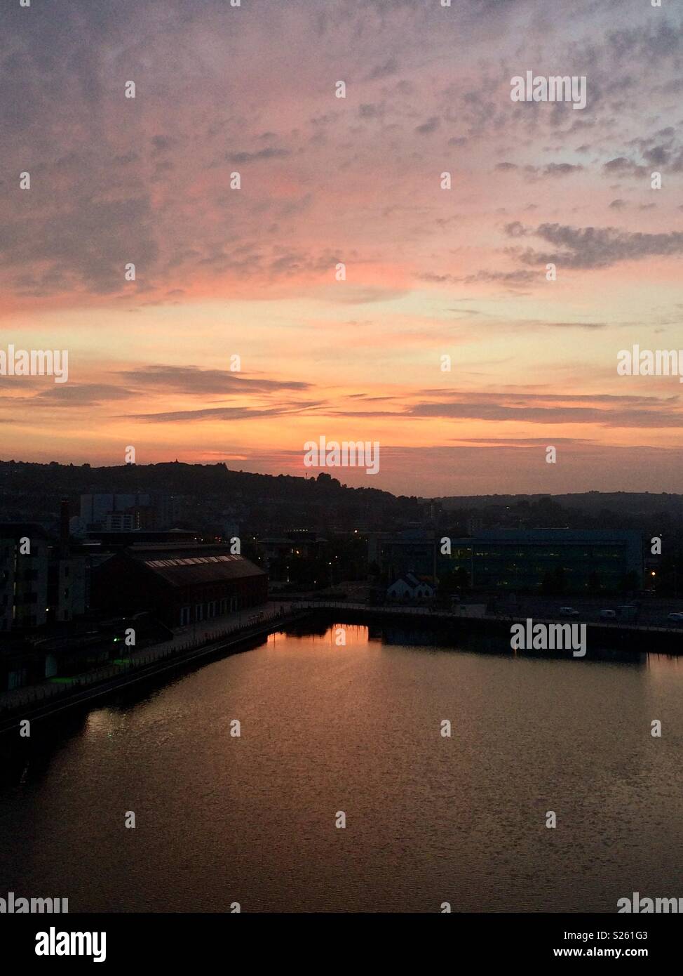 Swansea docks at sunset SA1 j shed and Norwegian church Stock Photo - Alamy