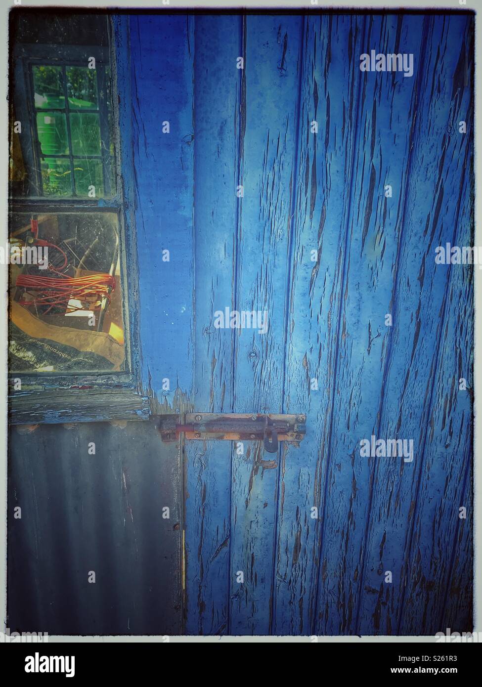 Weathered blue shed door Stock Photo - Alamy