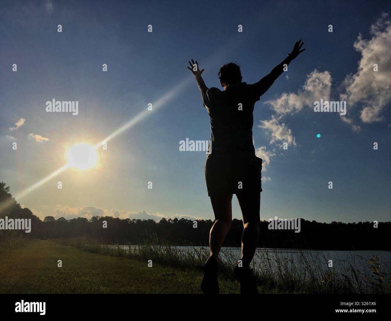 Woman jumping- excited silhouette Stock Photo - Alamy