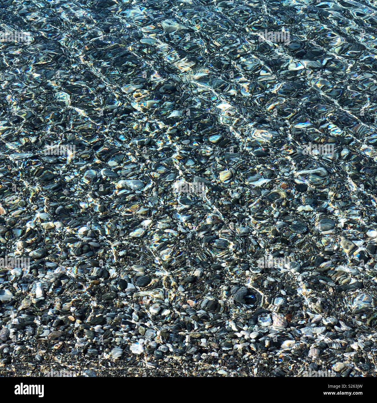 Pebbles in the sea Stock Photo - Alamy