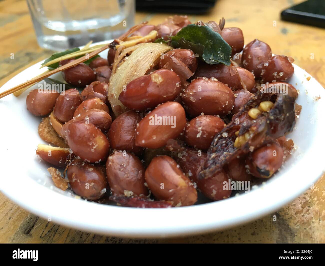 Fried peanuts with asian flavors Stock Photo - Alamy