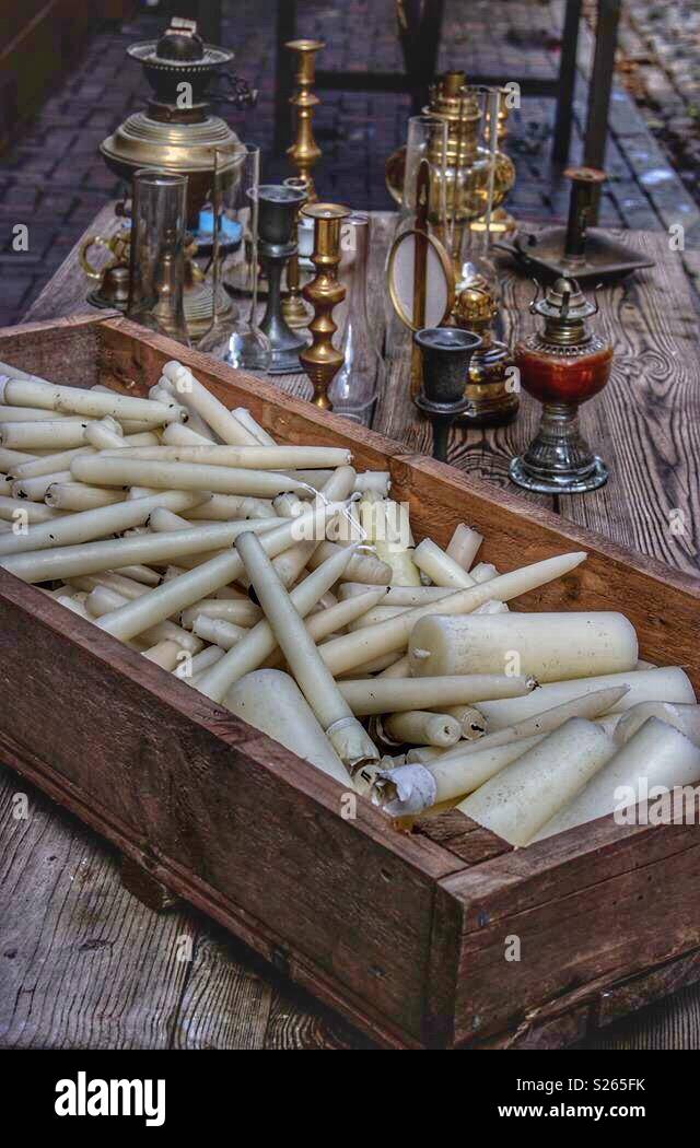 Victorian market stall with lanterns and candles in a box on a wooden ...