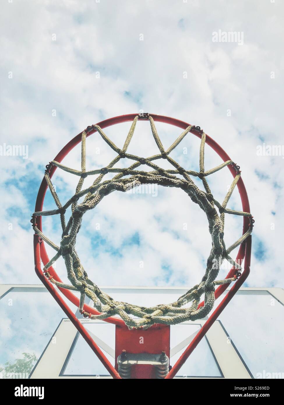 Looking up through a basketball hoop at the sky Stock Photo - Alamy