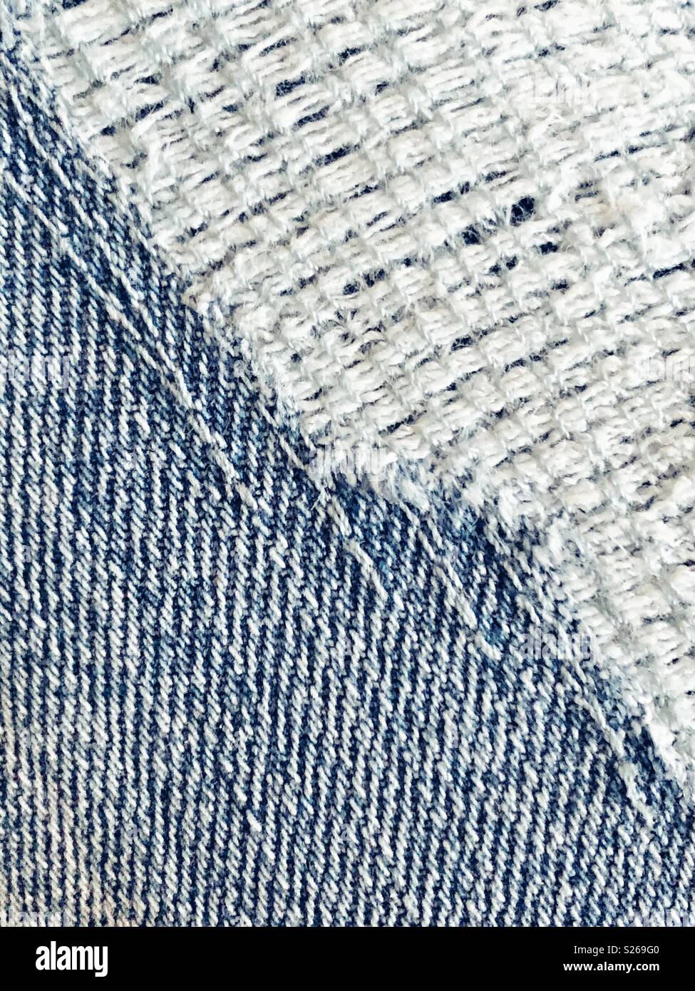 Blue denim fabric closeup with a frayed area Stock Photo - Alamy
