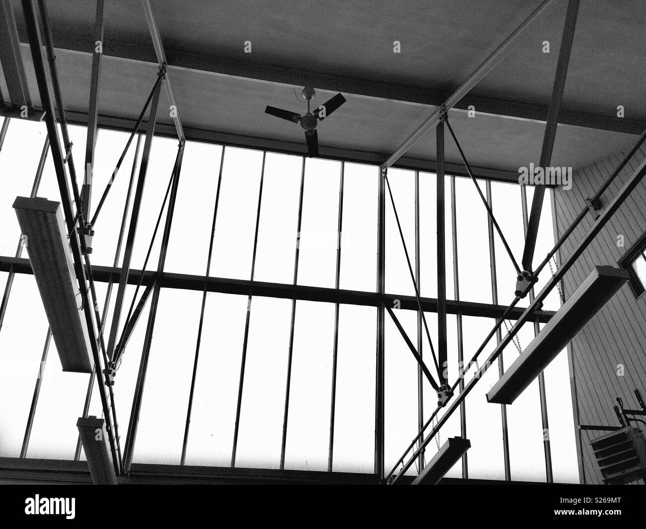 Art studio skylight with beams, lights and fan Stock Photo - Alamy