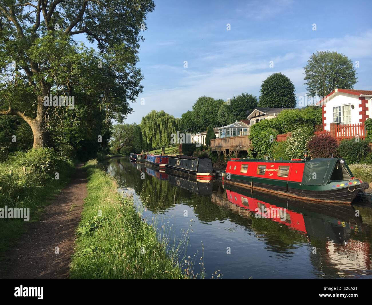 A canal side scene with canal boats moored up in the Worcestershire ...