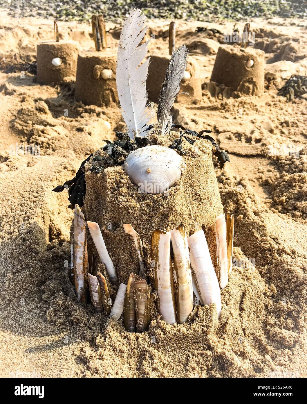 Sandcastle with feathers hi-res stock photography and images - Alamy