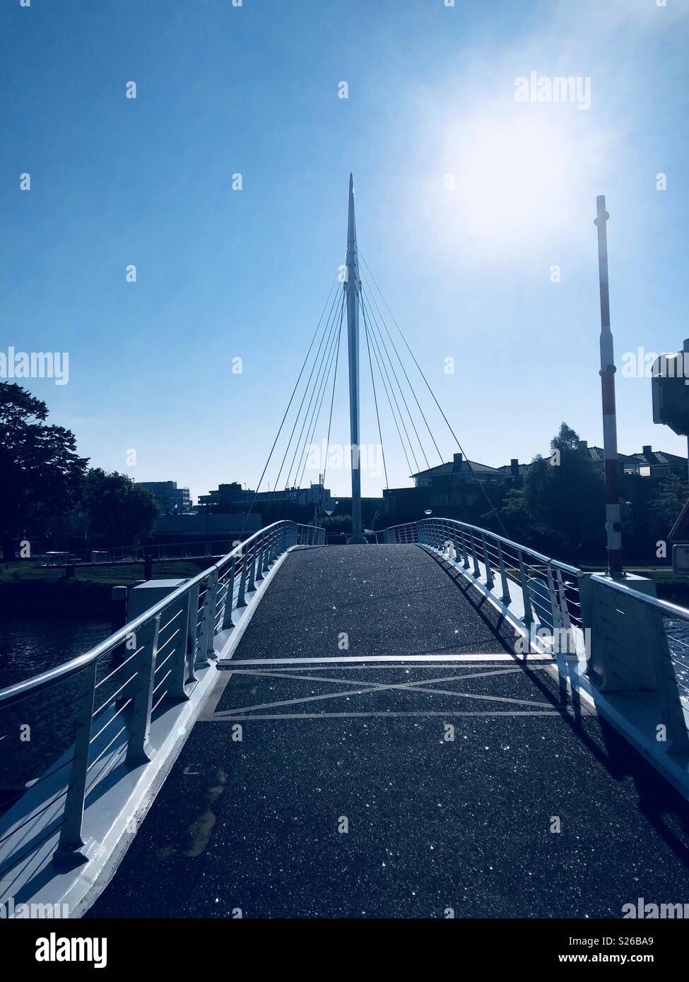 Bridge to cross the canal Stock Photo - Alamy