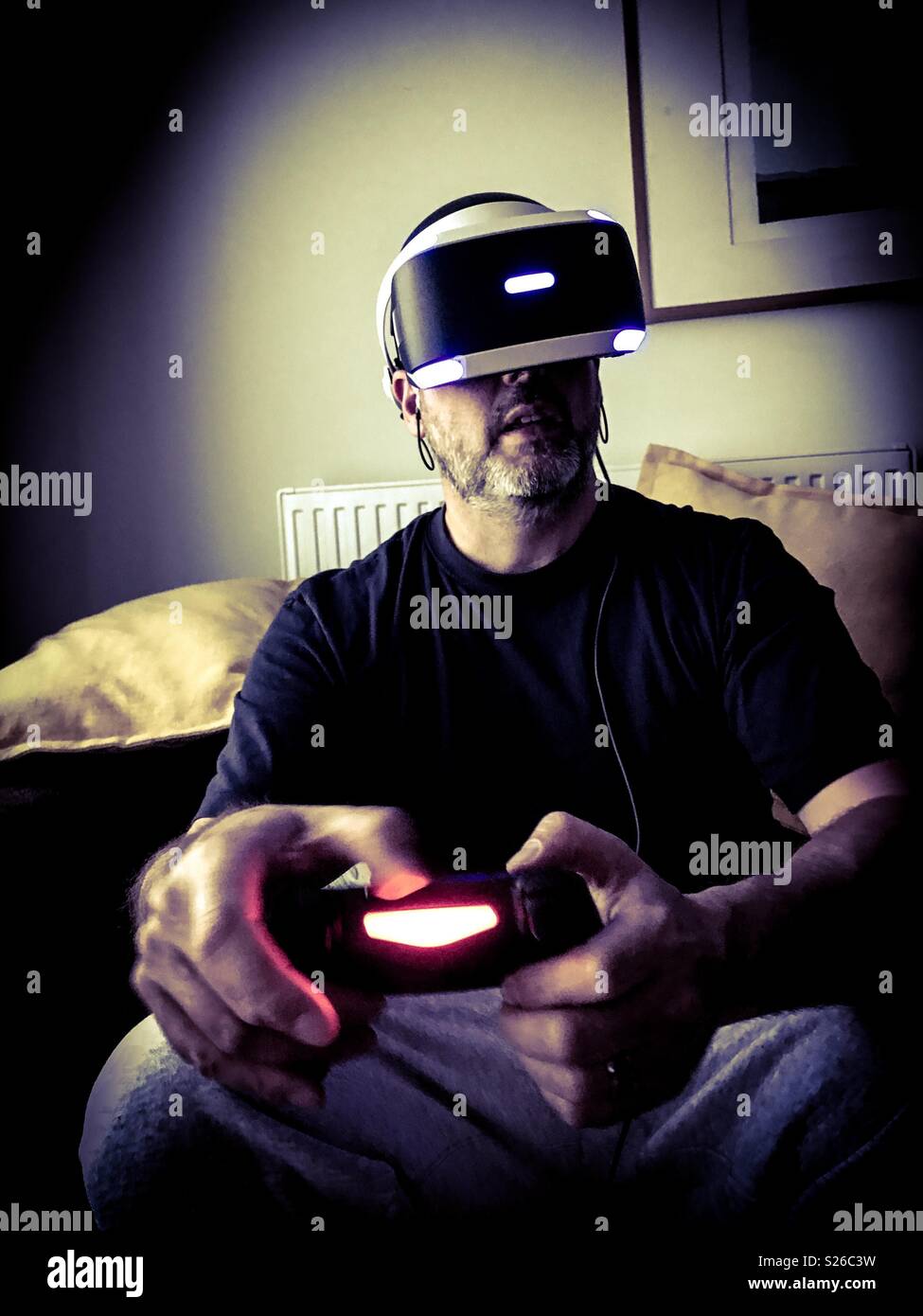Man using a virtual head set Stock Photo - Alamy