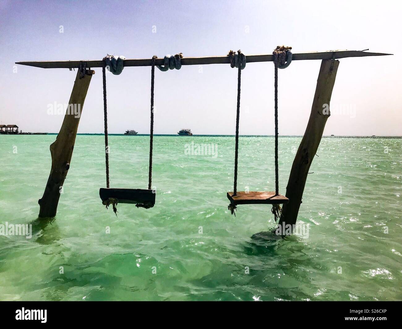 Swing in the sea Stock Photo - Alamy