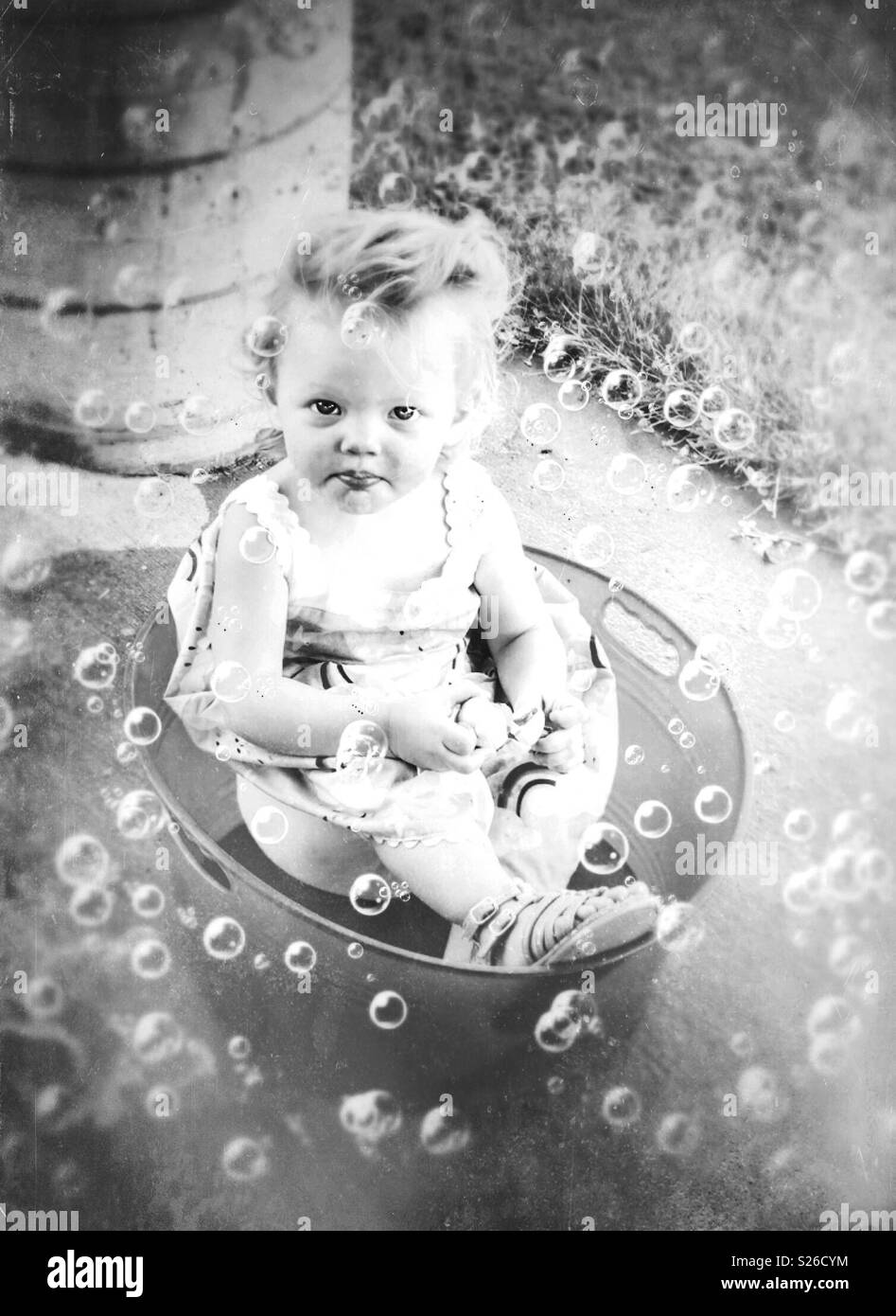 Baby in a bucket hi-res stock photography and images - Alamy