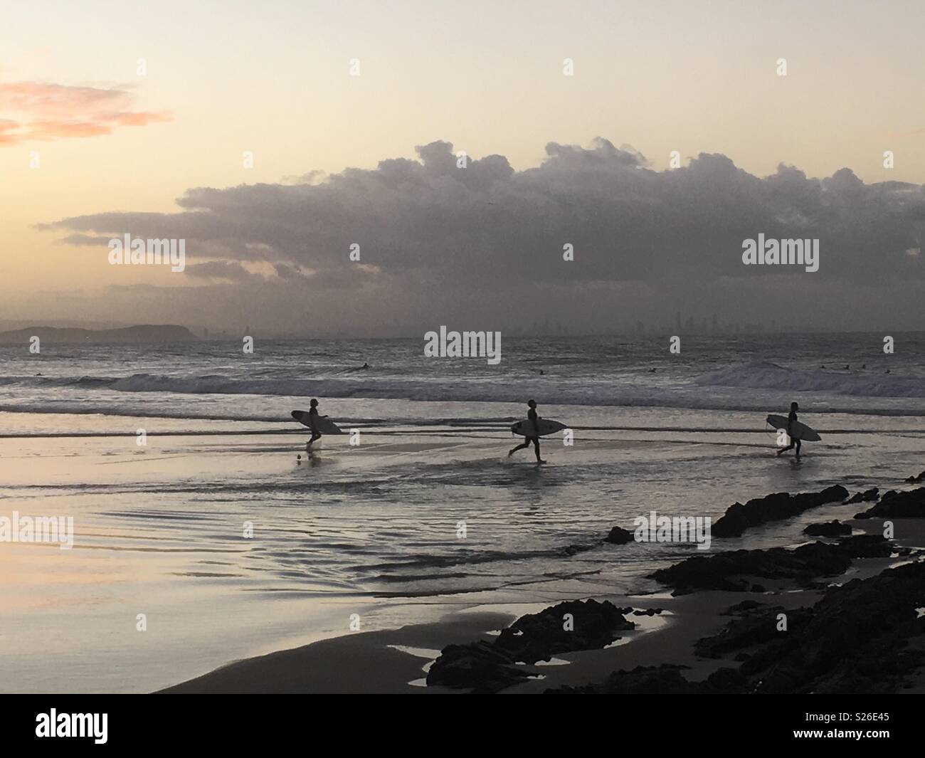 Three surfers hi-res stock photography and images - Alamy