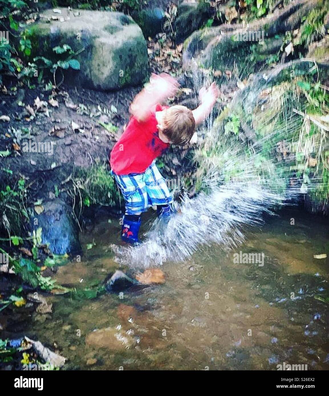 Fun in the river Stock Photo - Alamy