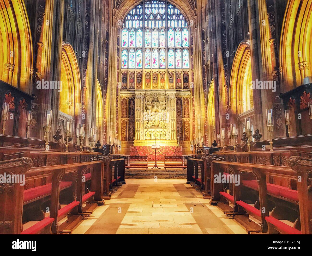 Altar, choir stalls, stained glass window, in the magnificent Sherborne ...