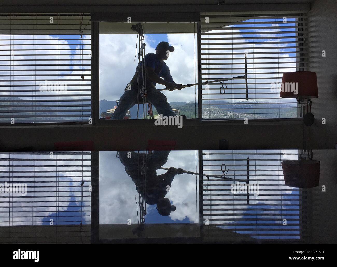 Window washer in high-rise building Stock Photo - Alamy