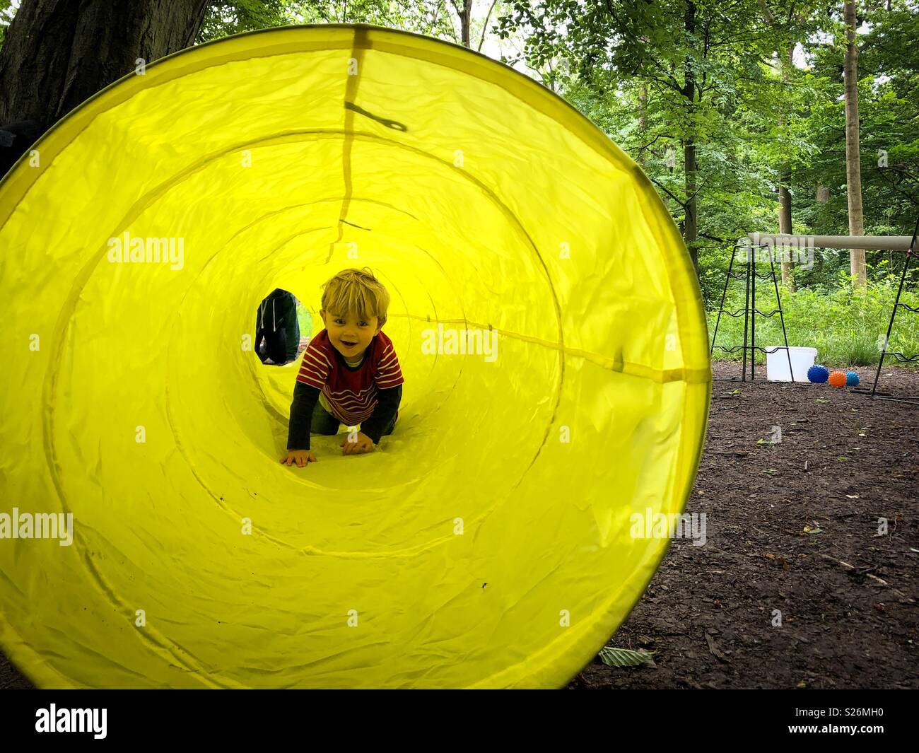 Child crawling through tunnel hi-res stock photography and images - Alamy