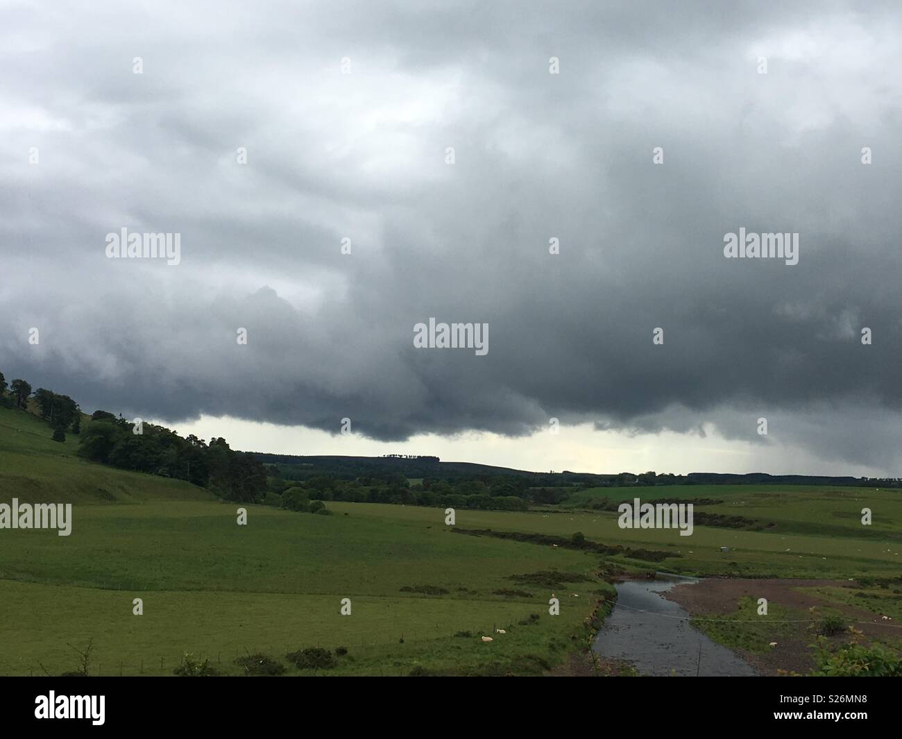 Storm cloud over the Whiteadder River in Scottish Borders Stock Photo ...