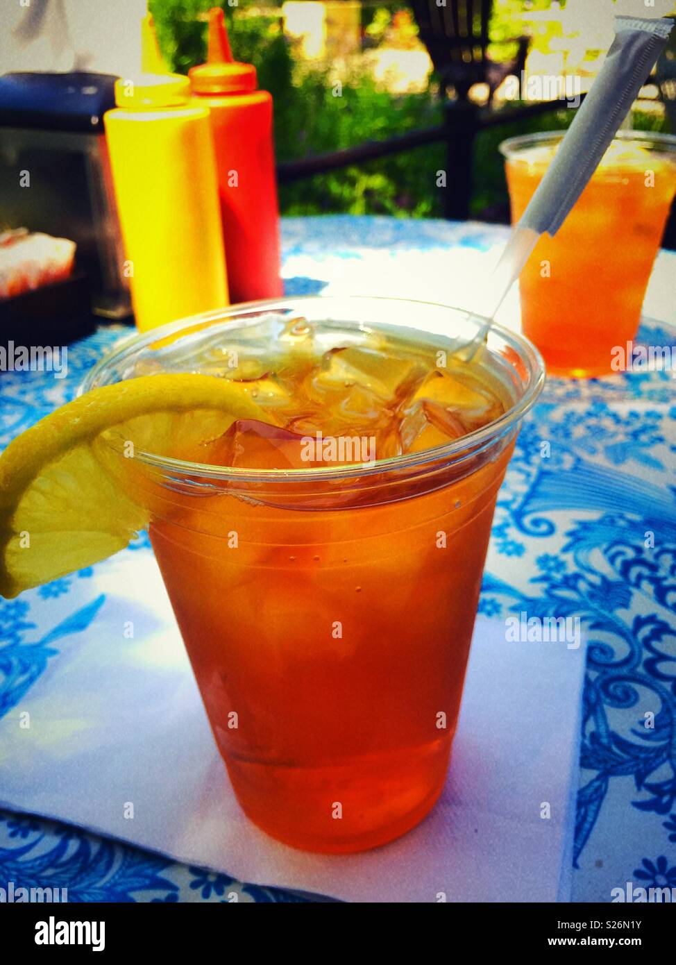 Refreshing glass of iced tea served at an alfresco restaurant in ...