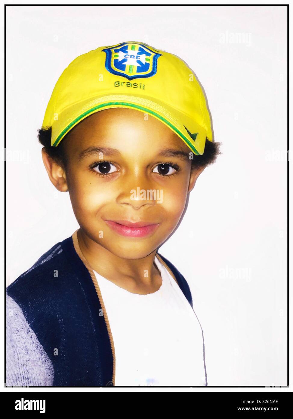 A little boy in. Brazil baseball cap Stock Photo - Alamy