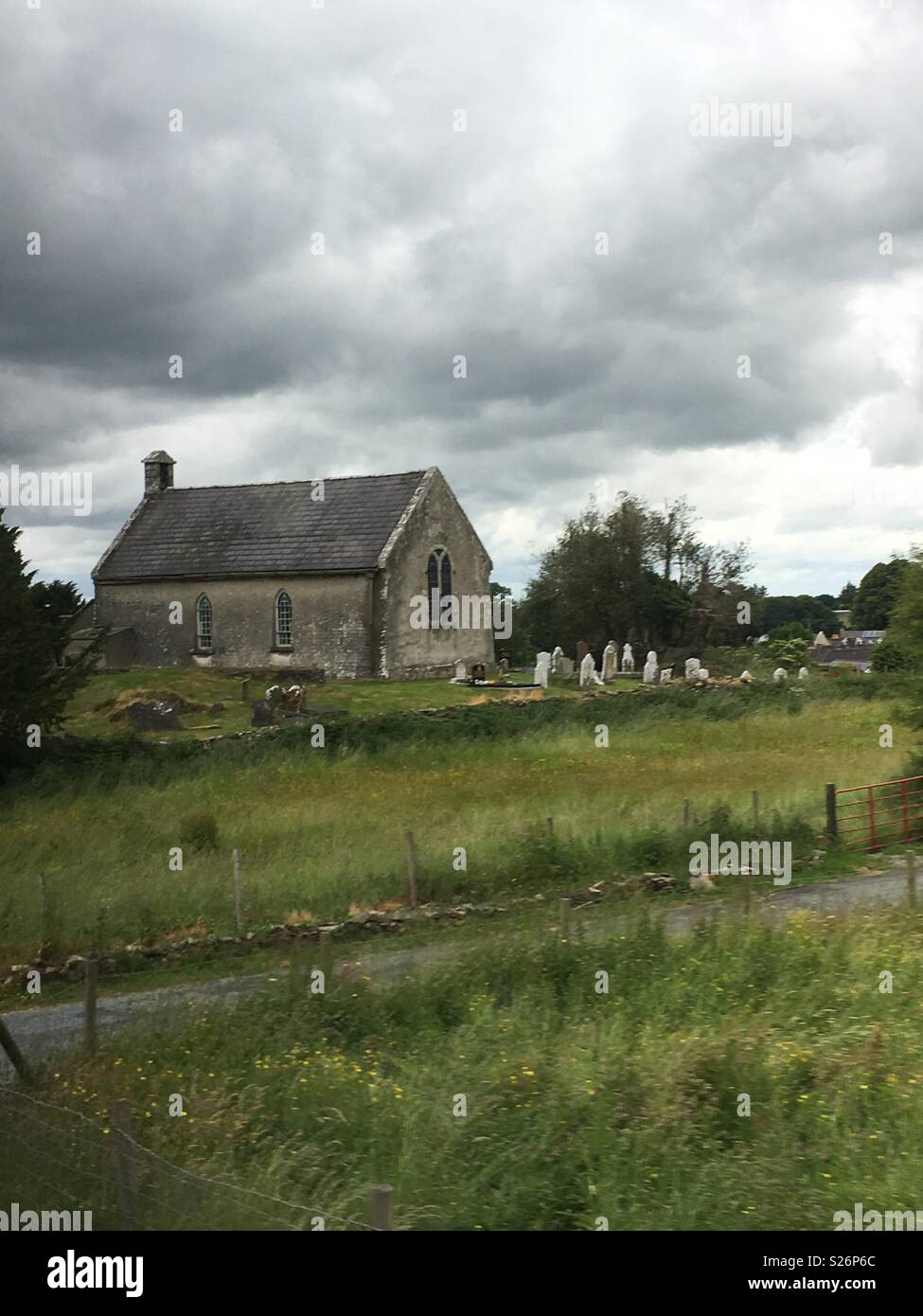 This photo was taken in Ireland. Church and graveyard Stock Photo - Alamy