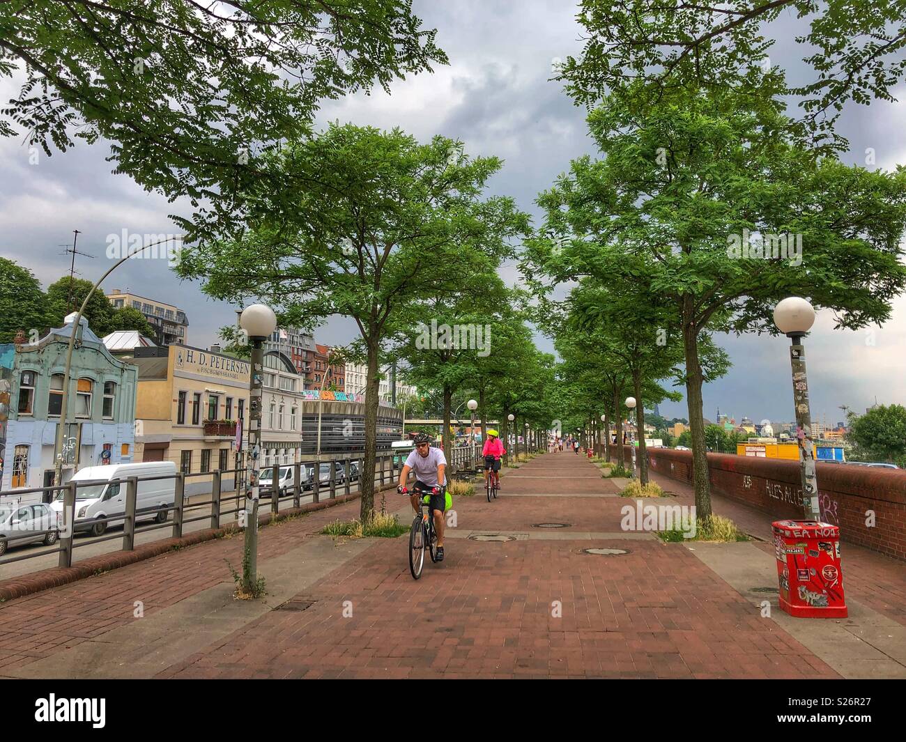 A wide tree-lined bicycle path in Hamburg, Germany Stock Photo - Alamy