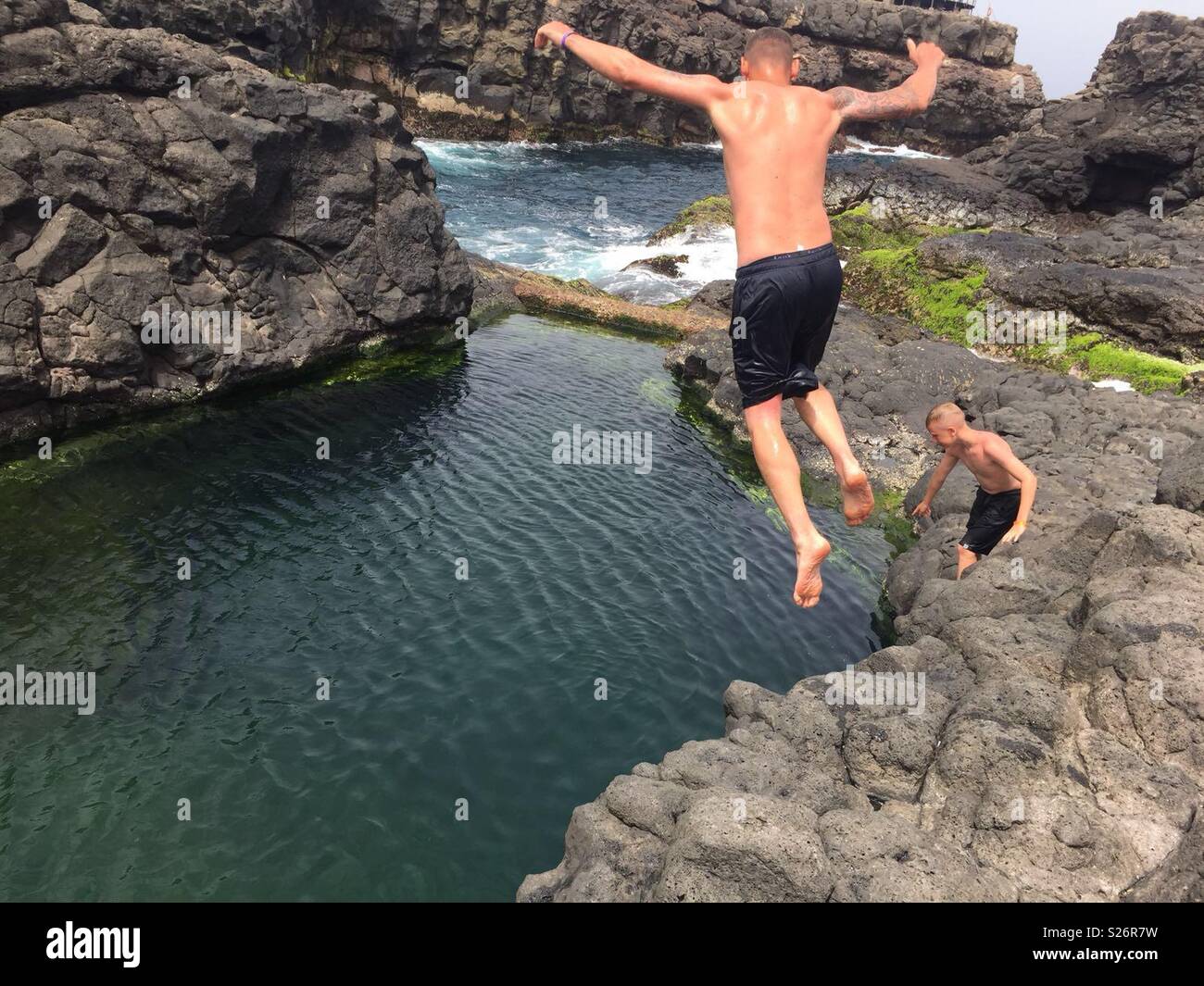 Man jumping in water Stock Photo - Alamy