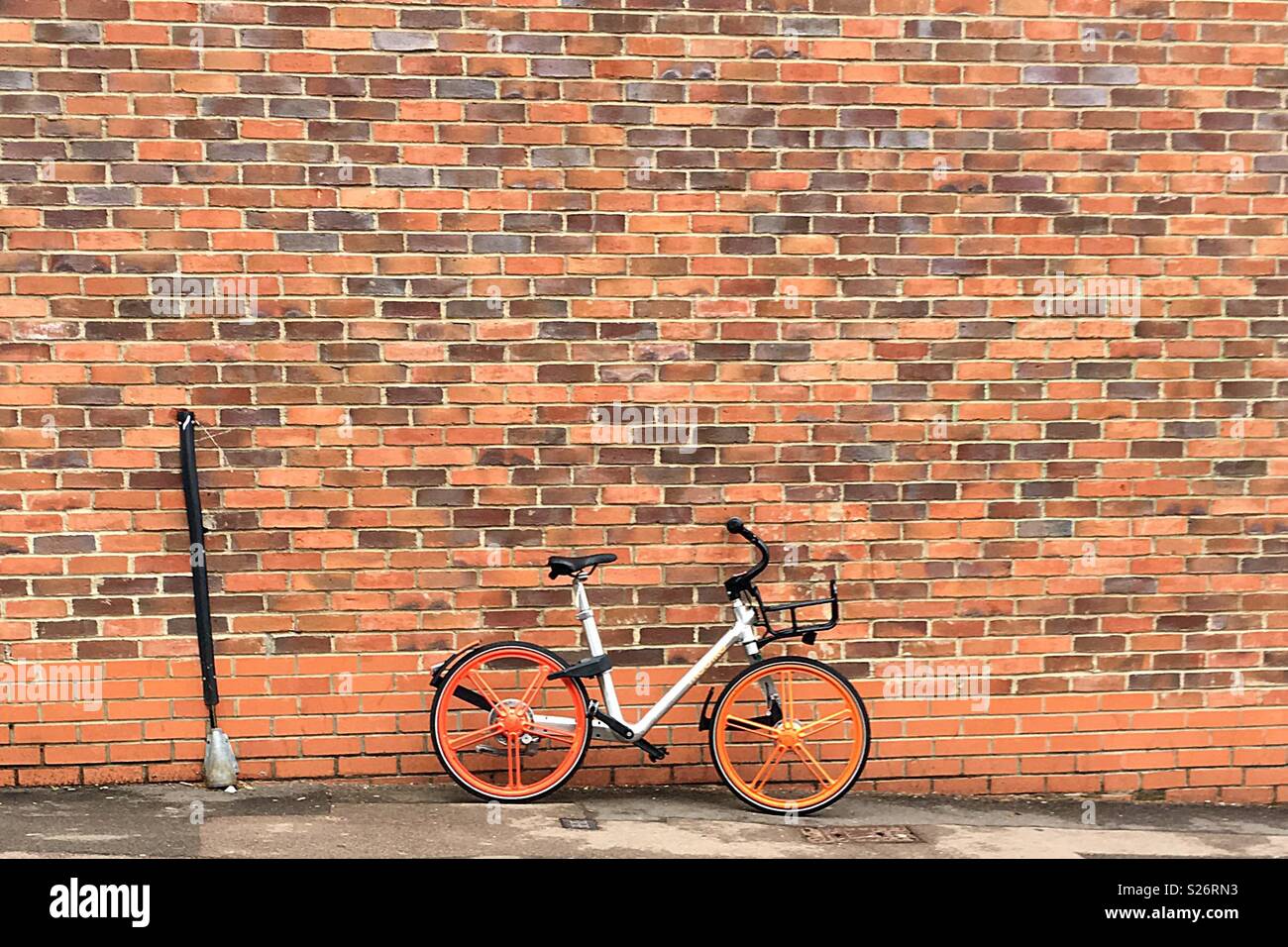 Bike on the wall Stock Photo - Alamy