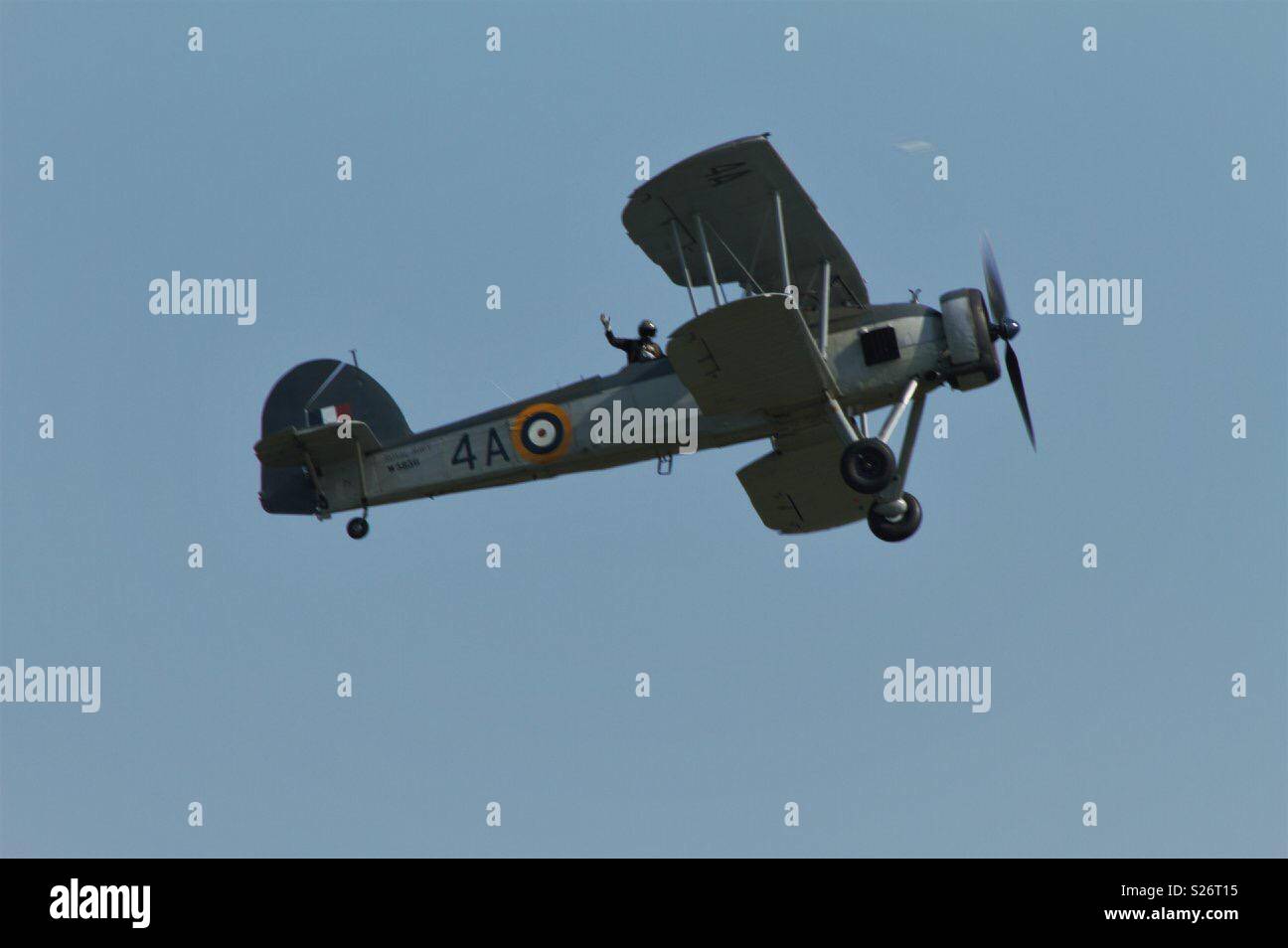 Plane with man waving Stock Photo - Alamy
